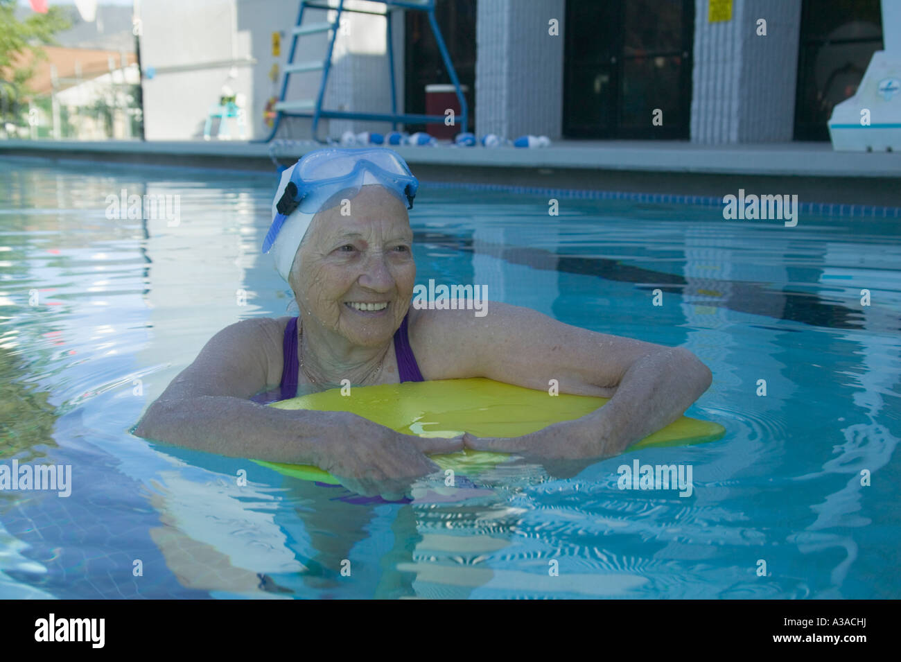 Senior woman exercising outdoor swimming pool Stock Photo - Alamy