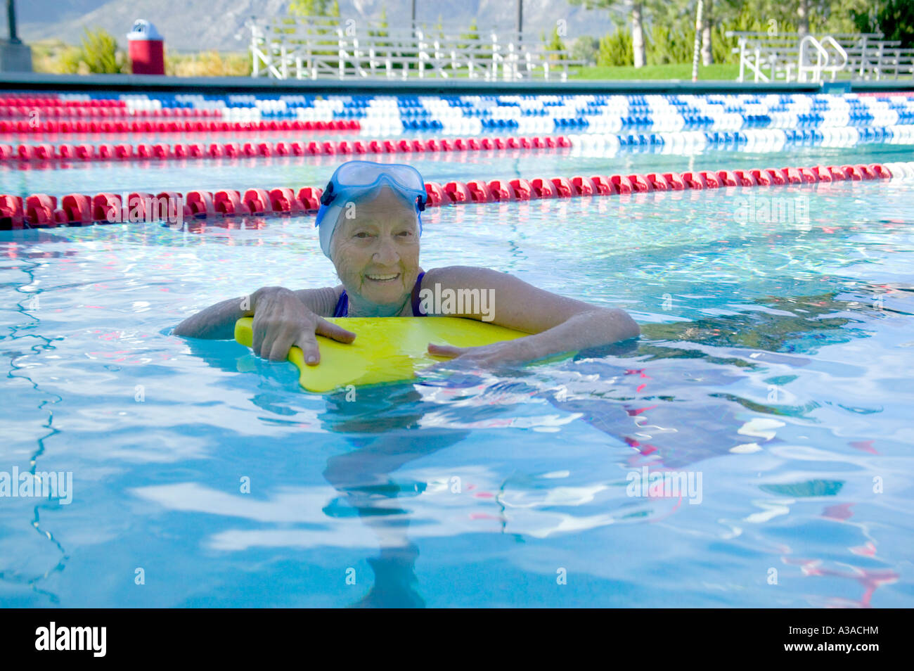 Senior woman exercising outdoor swimming pool Stock Photo - Alamy