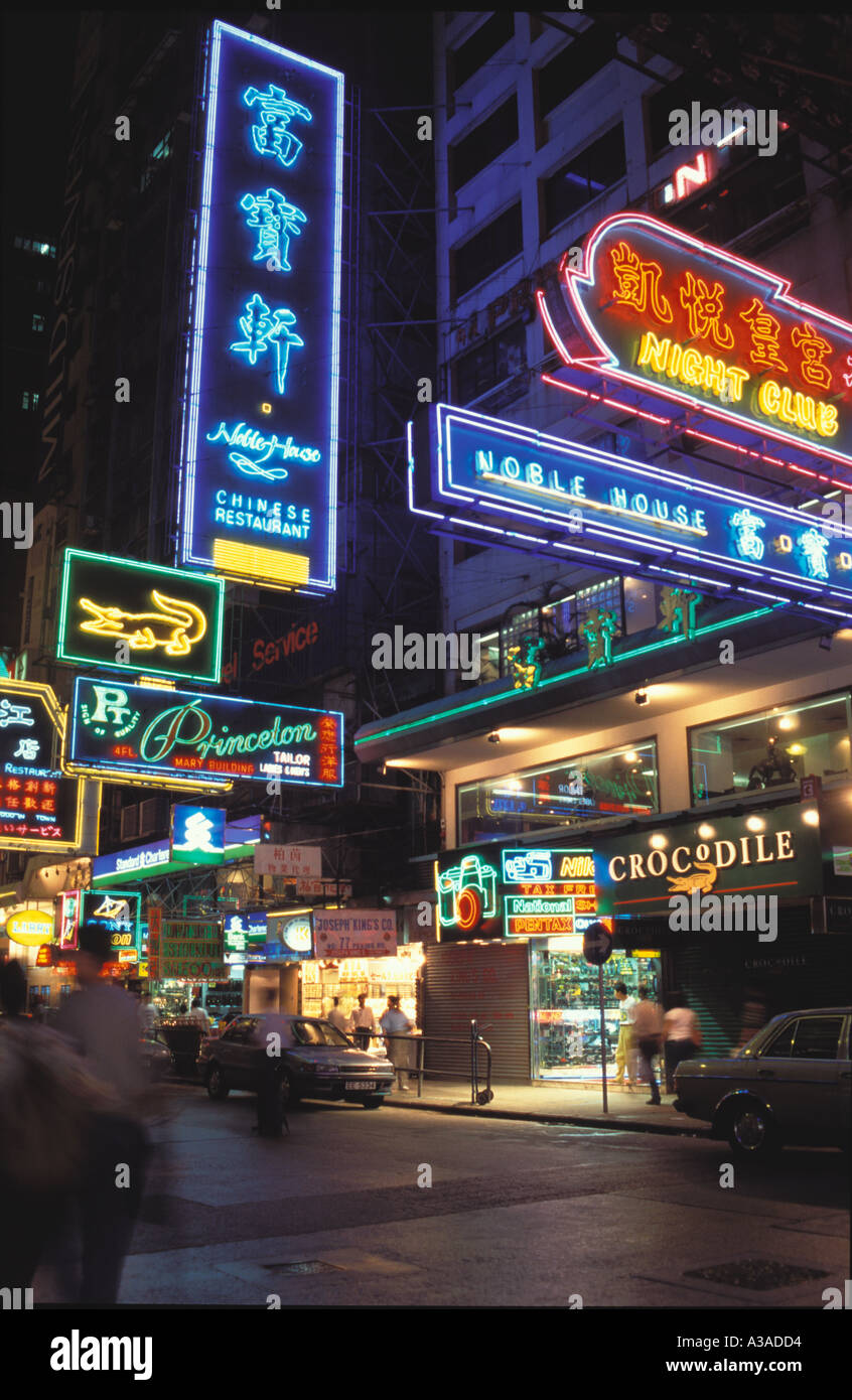 Brightly lit illuminated advertising, shop and restaurant signs over ...