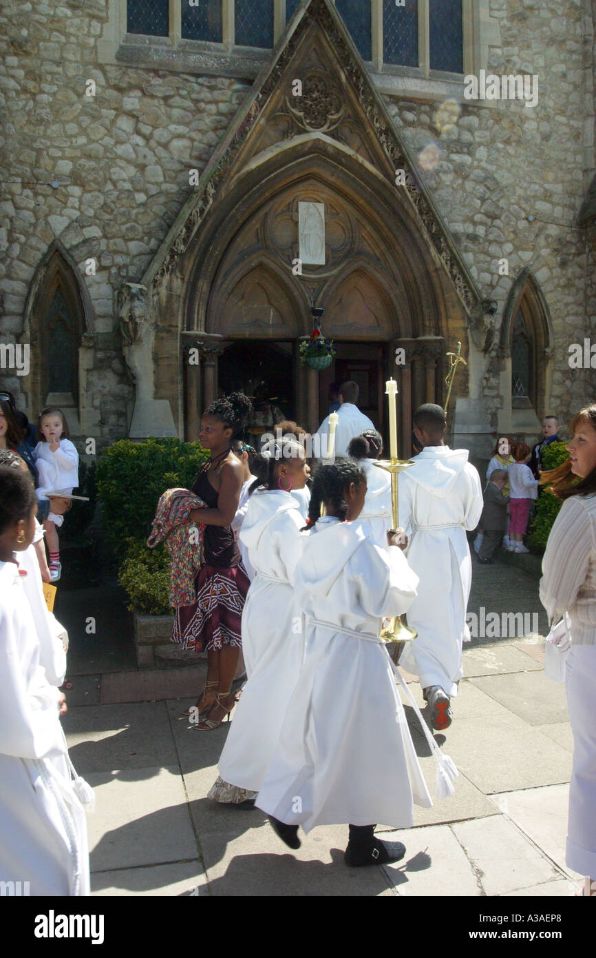 Young Catholic girls and boys arriving at church for their first Holy ...