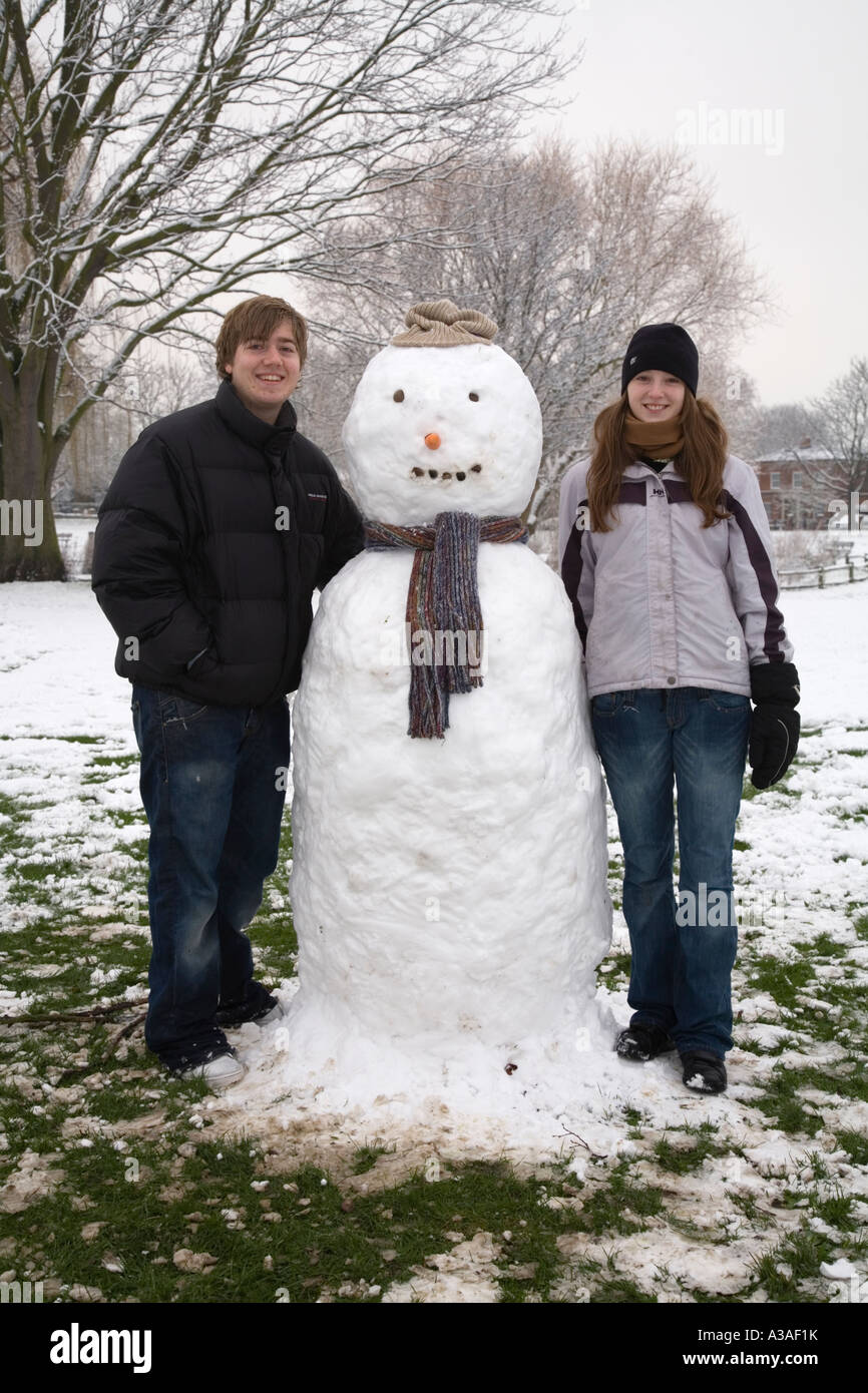 Snowman with couple on Ham Common Surrey UK Stock Photo - Alamy