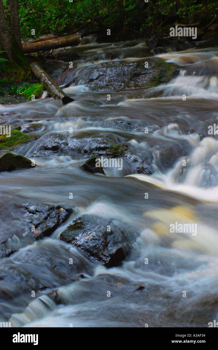 Water streaming over rocks Stock Photo - Alamy
