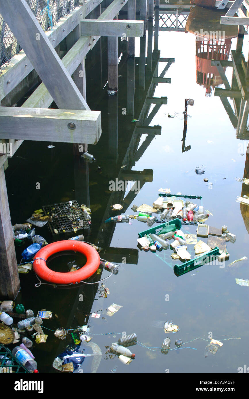 life belt in dock with modern waste Stock Photo - Alamy