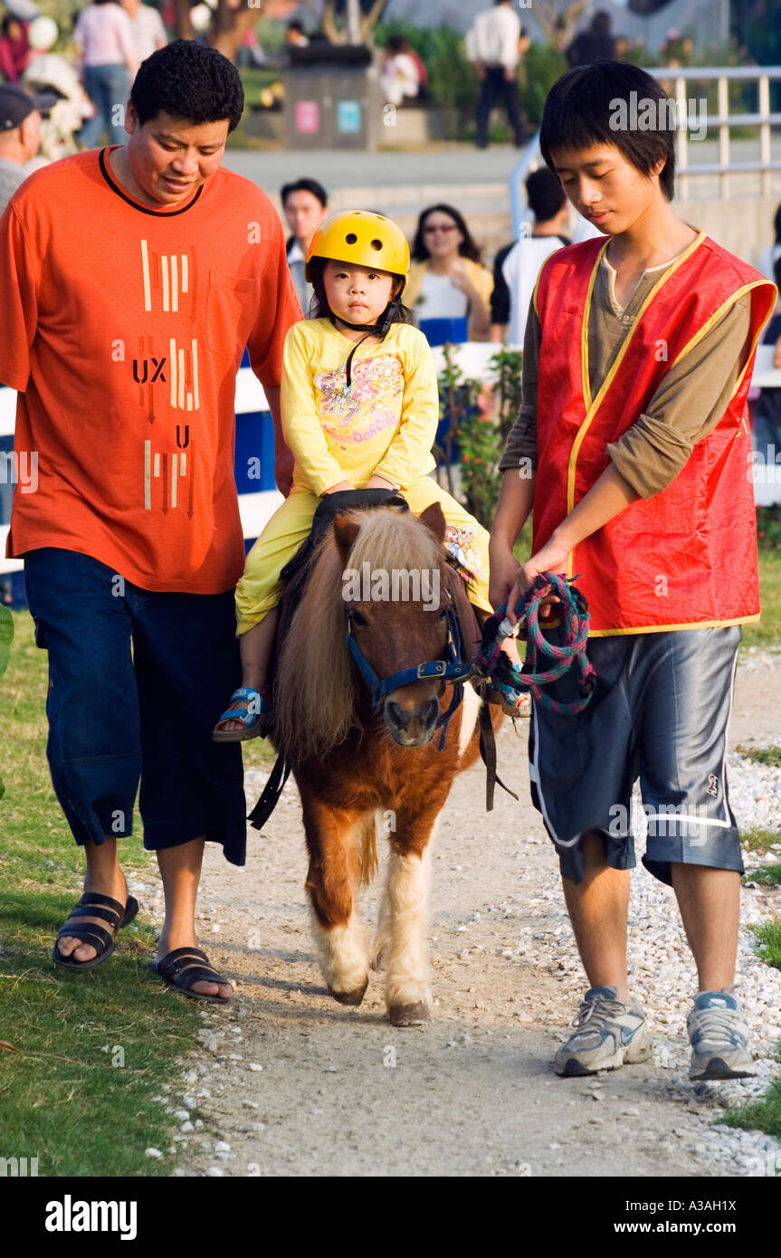 girl on pony ride Dansui Tamsui fishing village Taipei Taiwan China ...