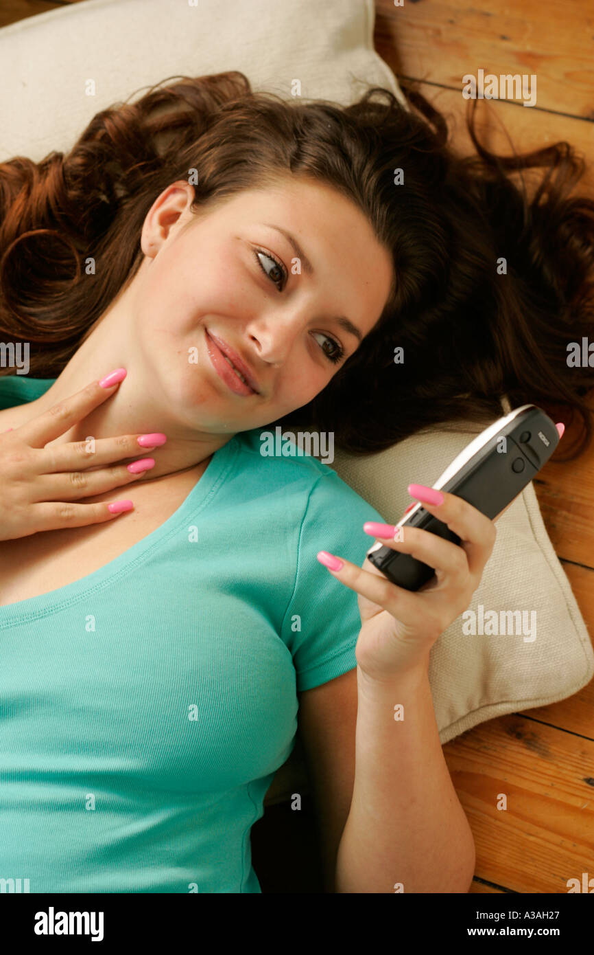 Young girl using phone Stock Photo - Alamy