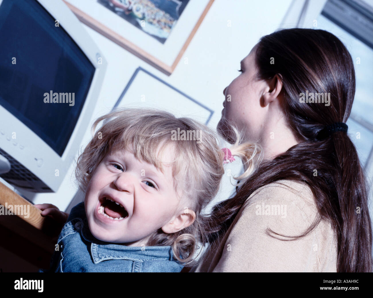 Mother with daughter using computer Stock Photo - Alamy