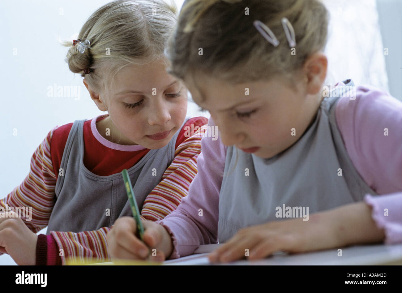 Two schoolgirls holding hands hi-res stock photography and images - Alamy