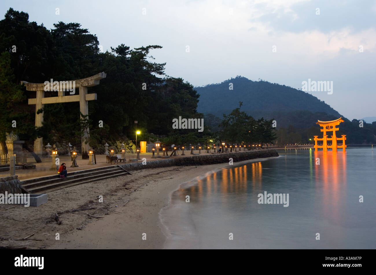 stone gate and red torii gate of Itsukushima jinja shrine Miyajima ...