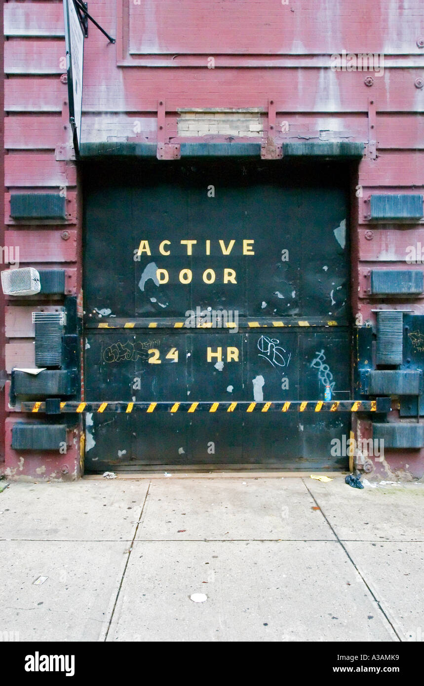 Active door black with yellow black hazard bars Stock Photo - Alamy