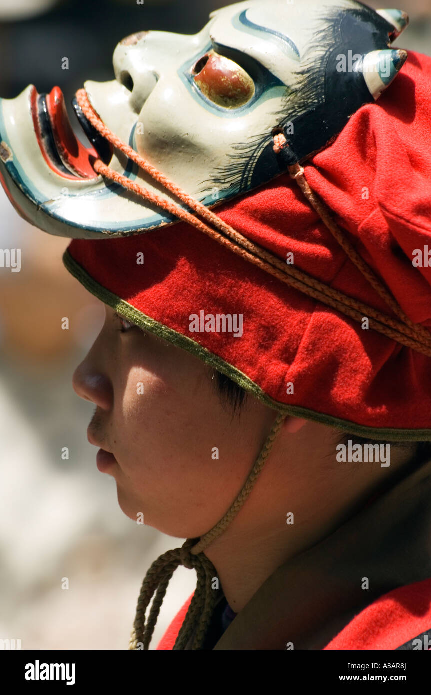 boy wearing traditional parade clothes and mask Nikko Spring Festival ...