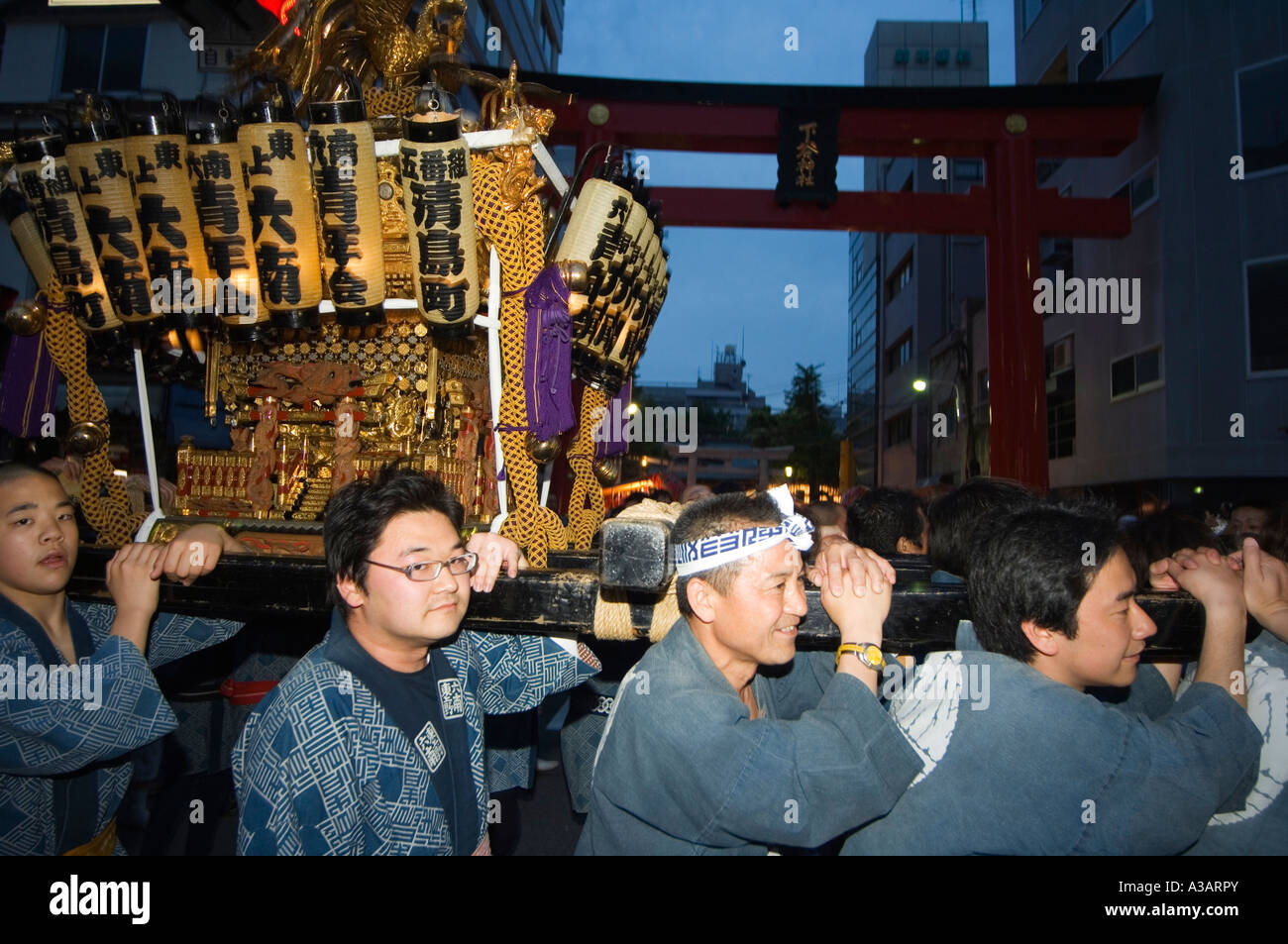Mikoshi portable shrine parade in front of Torii gate Annual Festival ...