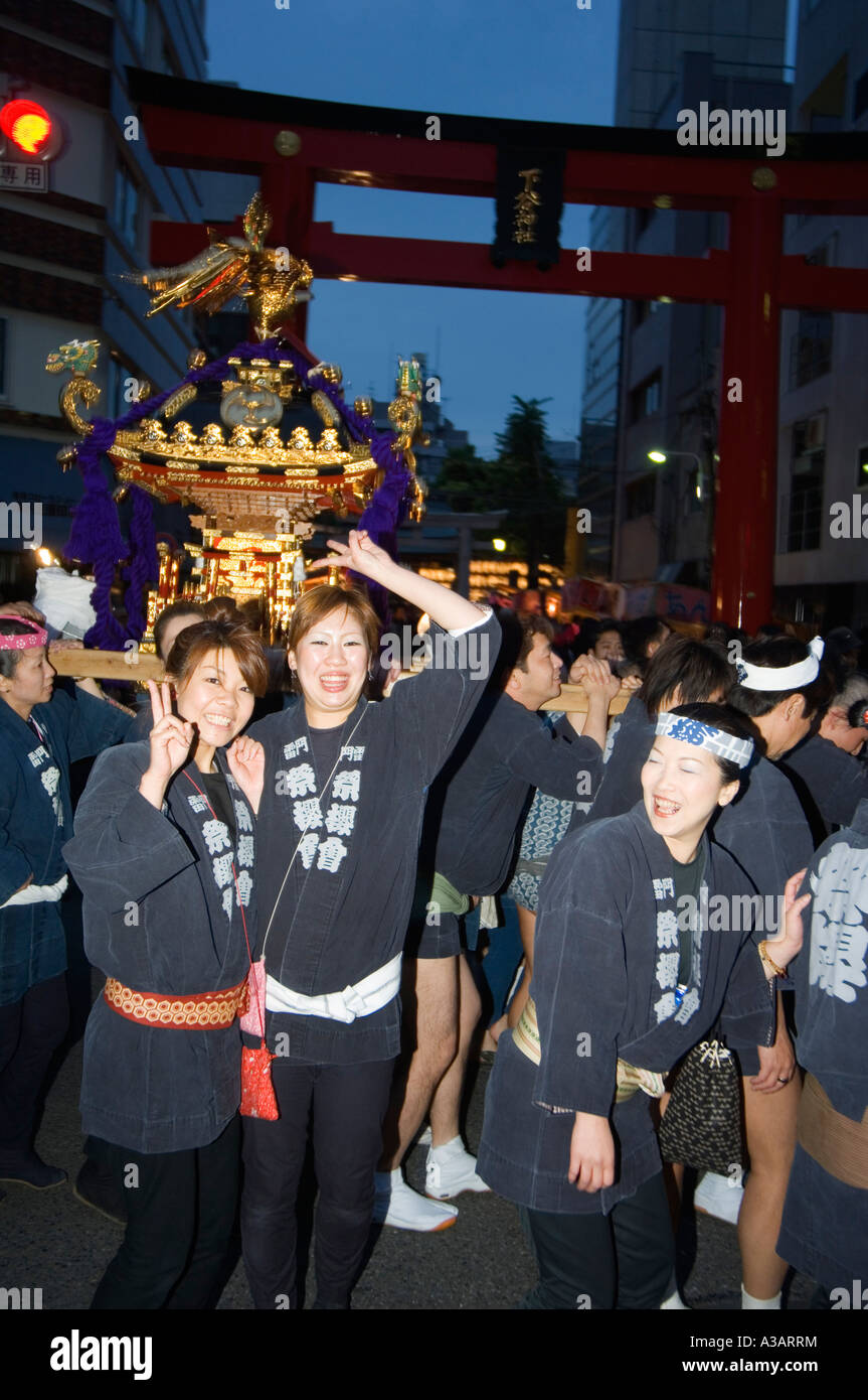 Mikoshi portable shrine parade in front of Torii gate Annual Festival ...