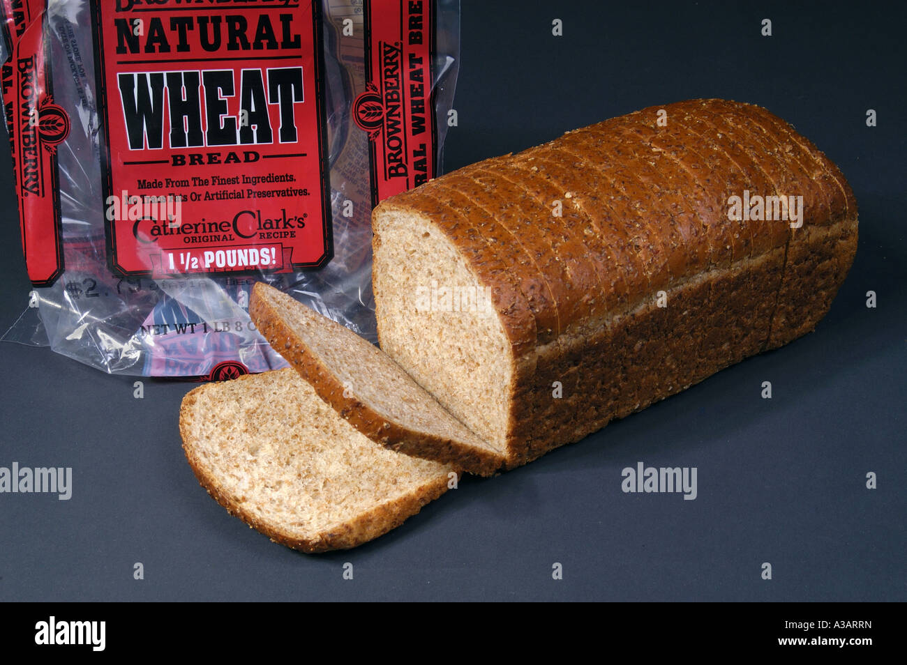 Studio shot of natural wheat bread loaf, sliced with cellophane ...