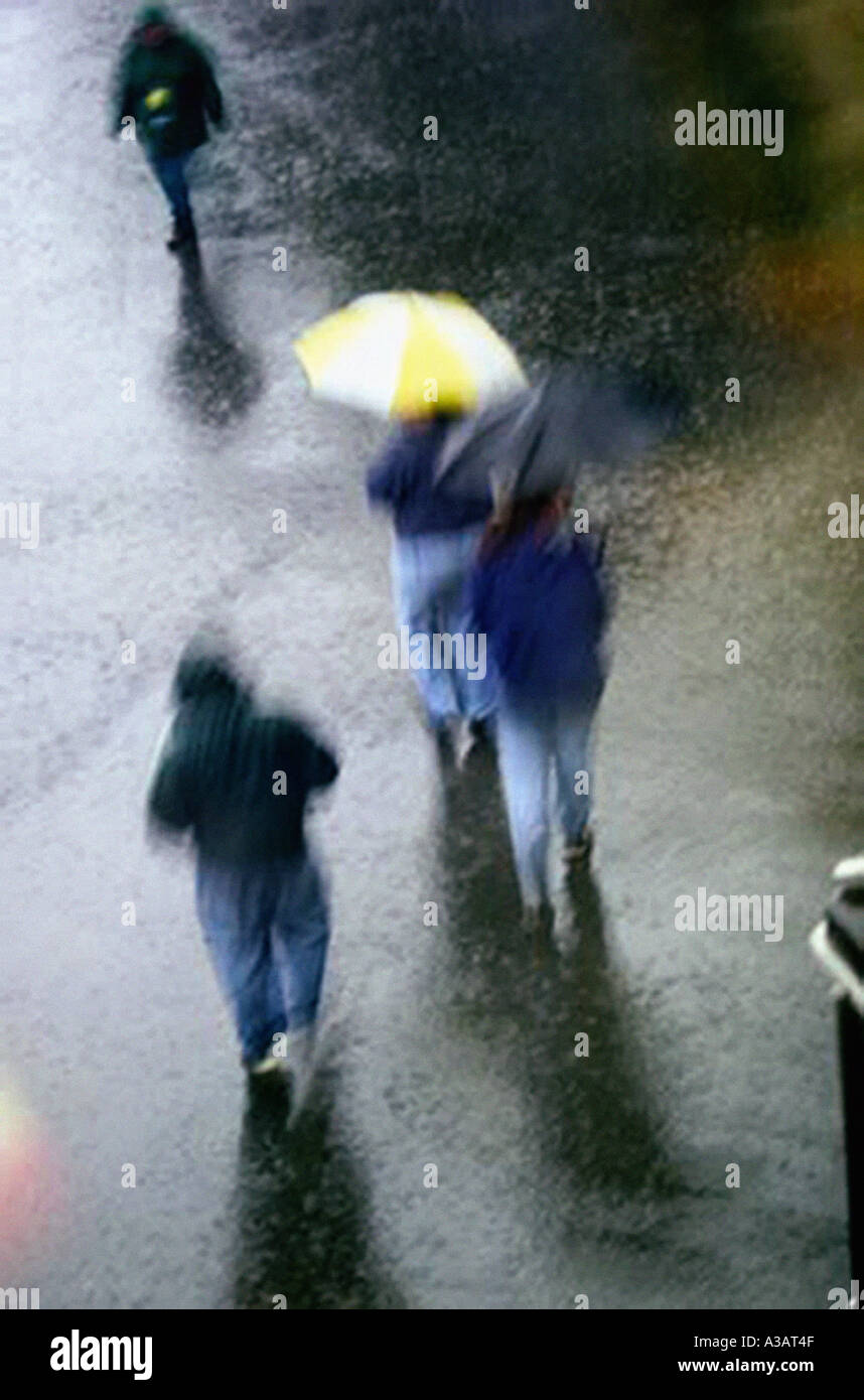 People hurrying through streets during rain storm Stock Photo - Alamy
