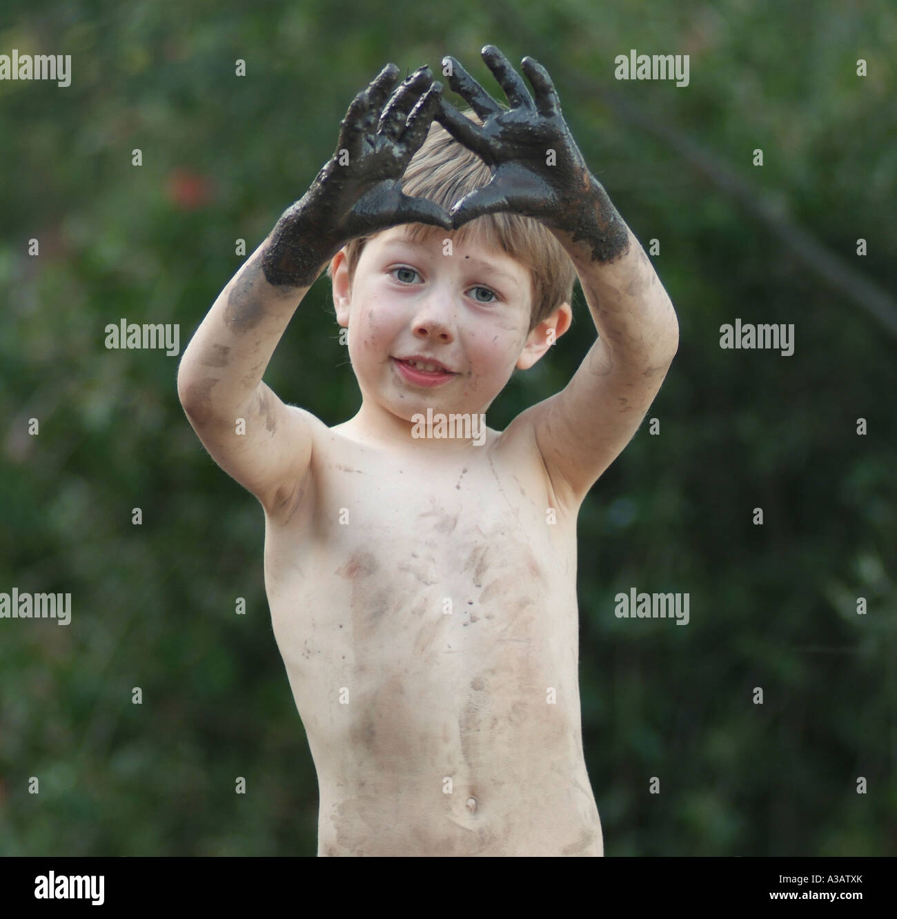 young boy with muddy hands Stock Photo - Alamy