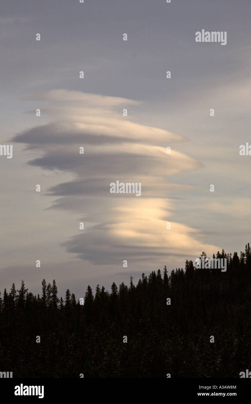 Odd formed cloud over Alberta forest Stock Photo - Alamy