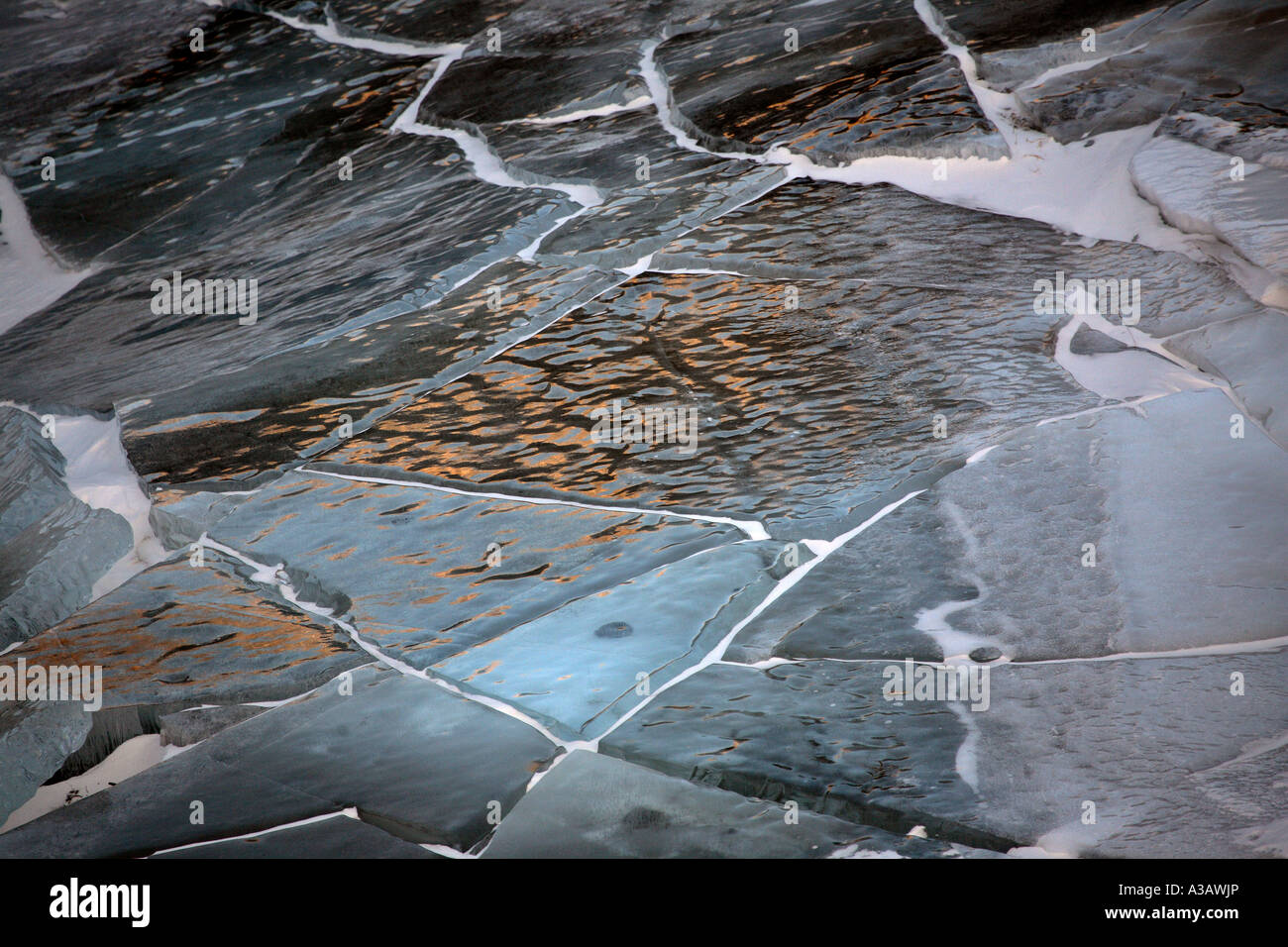 cracked ice patterns in winter Stock Photo - Alamy