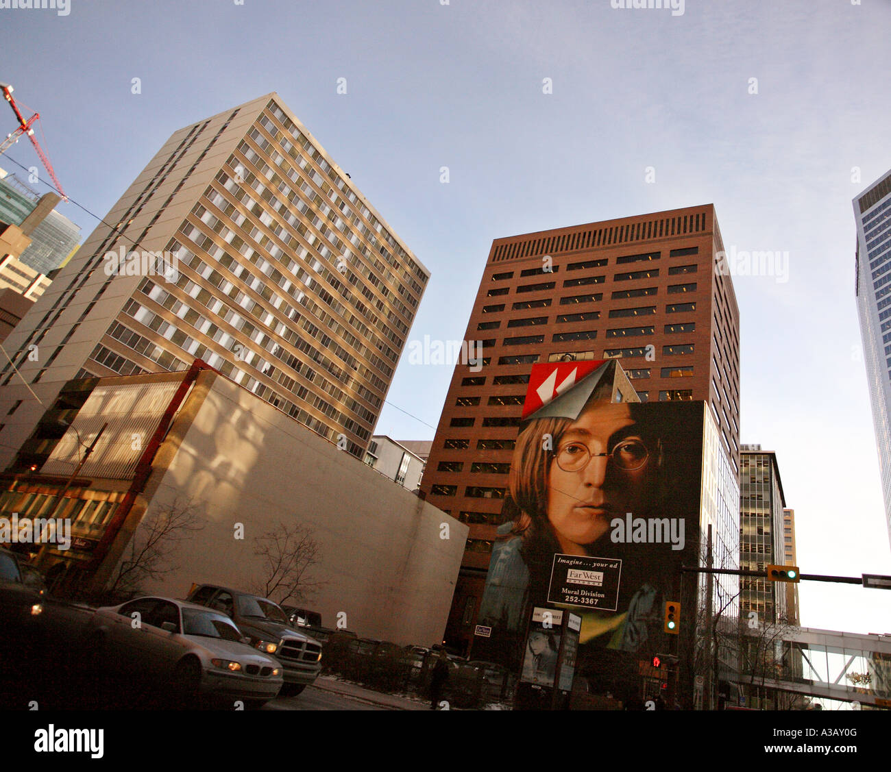 buildings in downtown Calgary with John Lennon mural Stock Photo - Alamy
