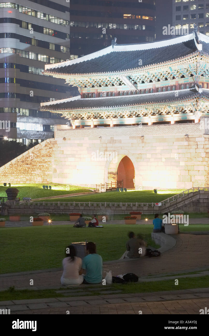 People Sitting In Front Of South Gate At Night Stock Photo - Alamy