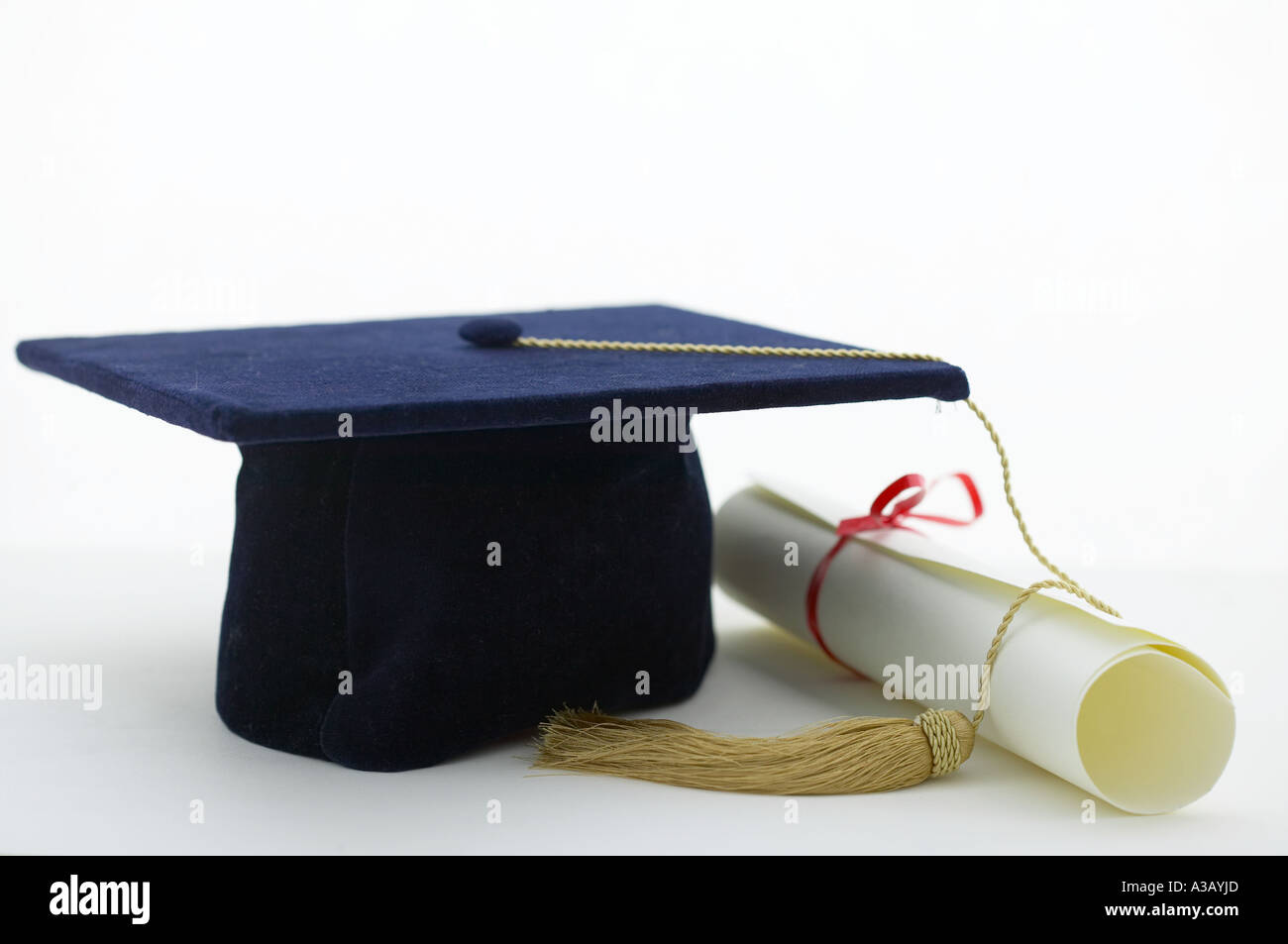 A graduation hat and certificate Stock Photo - Alamy