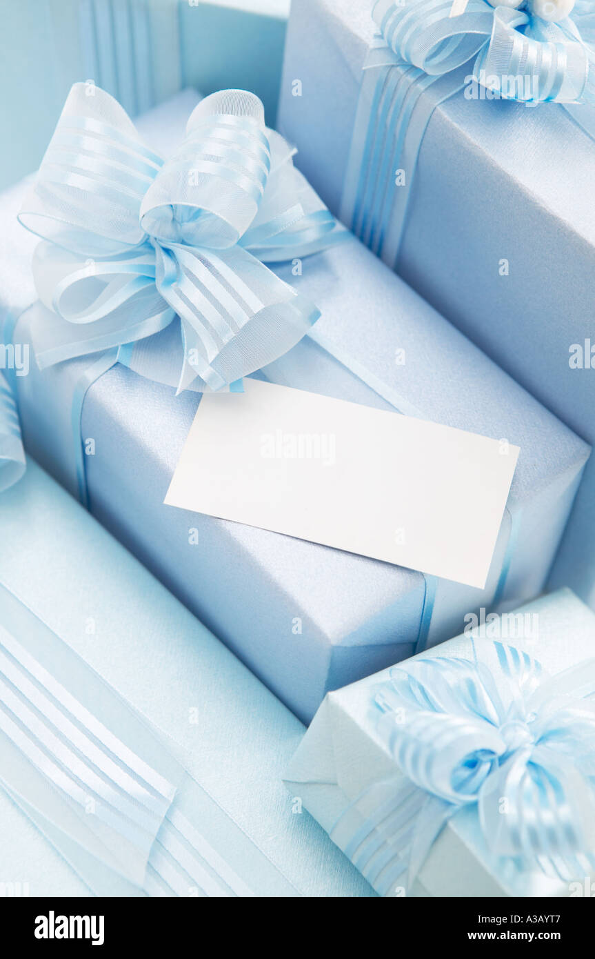 Blue gift boxes and an empty greetings note Stock Photo - Alamy