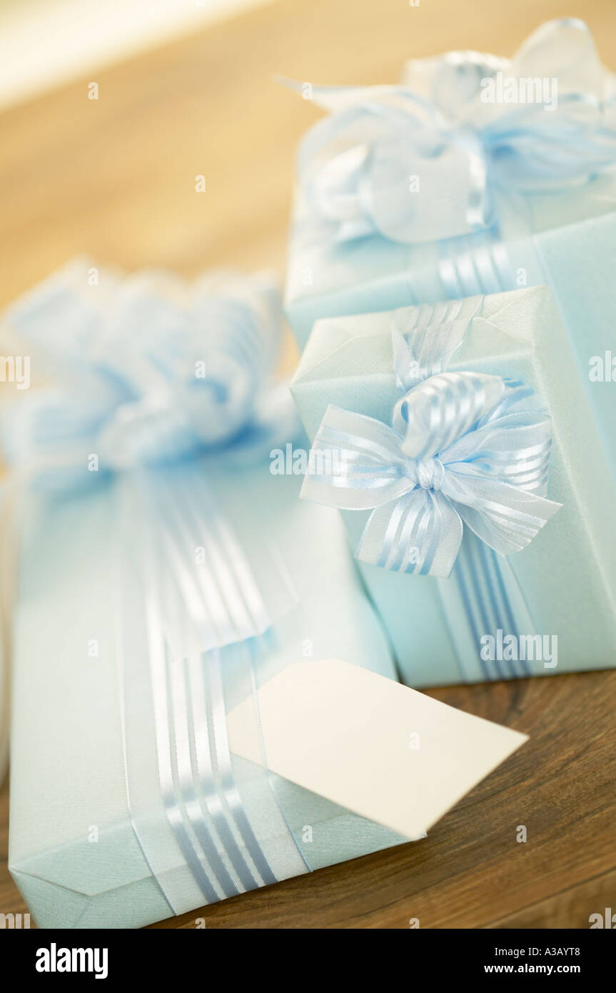 Blue gift boxes with an empty greetings note Stock Photo - Alamy
