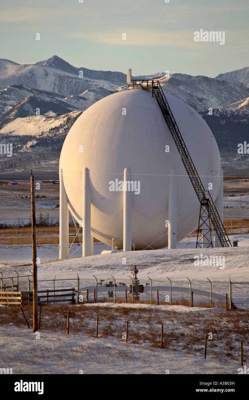 Oil storage tank near mountains Stock Photo - Alamy