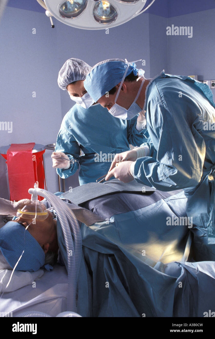 Doctor performing an operation Stock Photo - Alamy