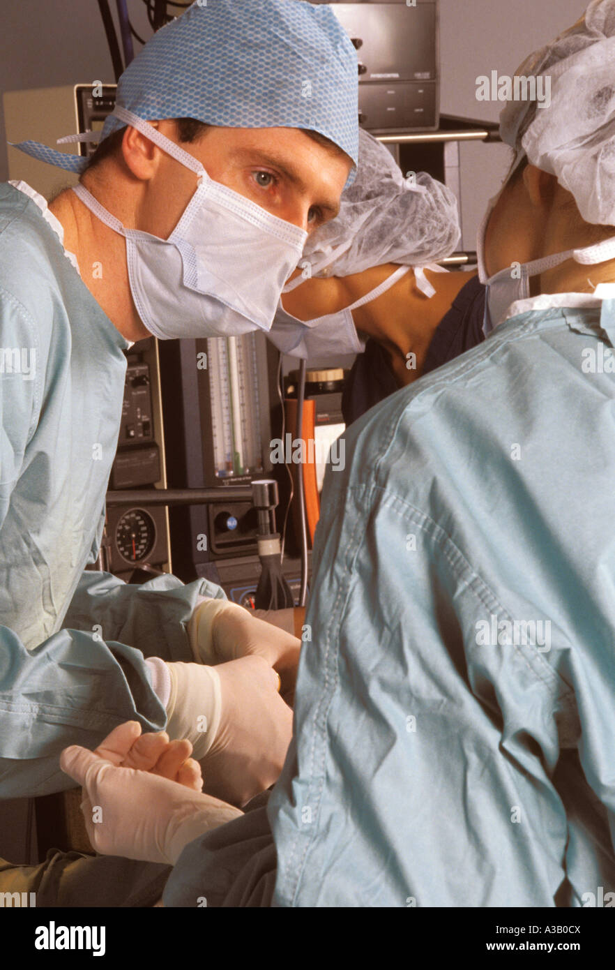 Doctor performing surgery on a patient Stock Photo - Alamy