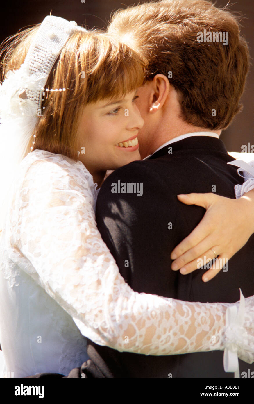 Bride and groom hugging Stock Photo - Alamy