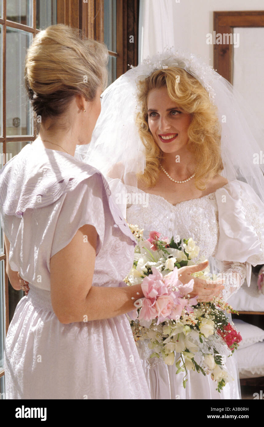 A bride with her mom getting ready Stock Photo - Alamy