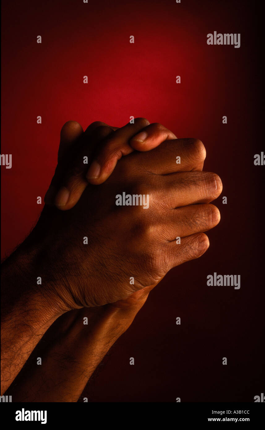 Clasped hands prayer black hi-res stock photography and images - Alamy