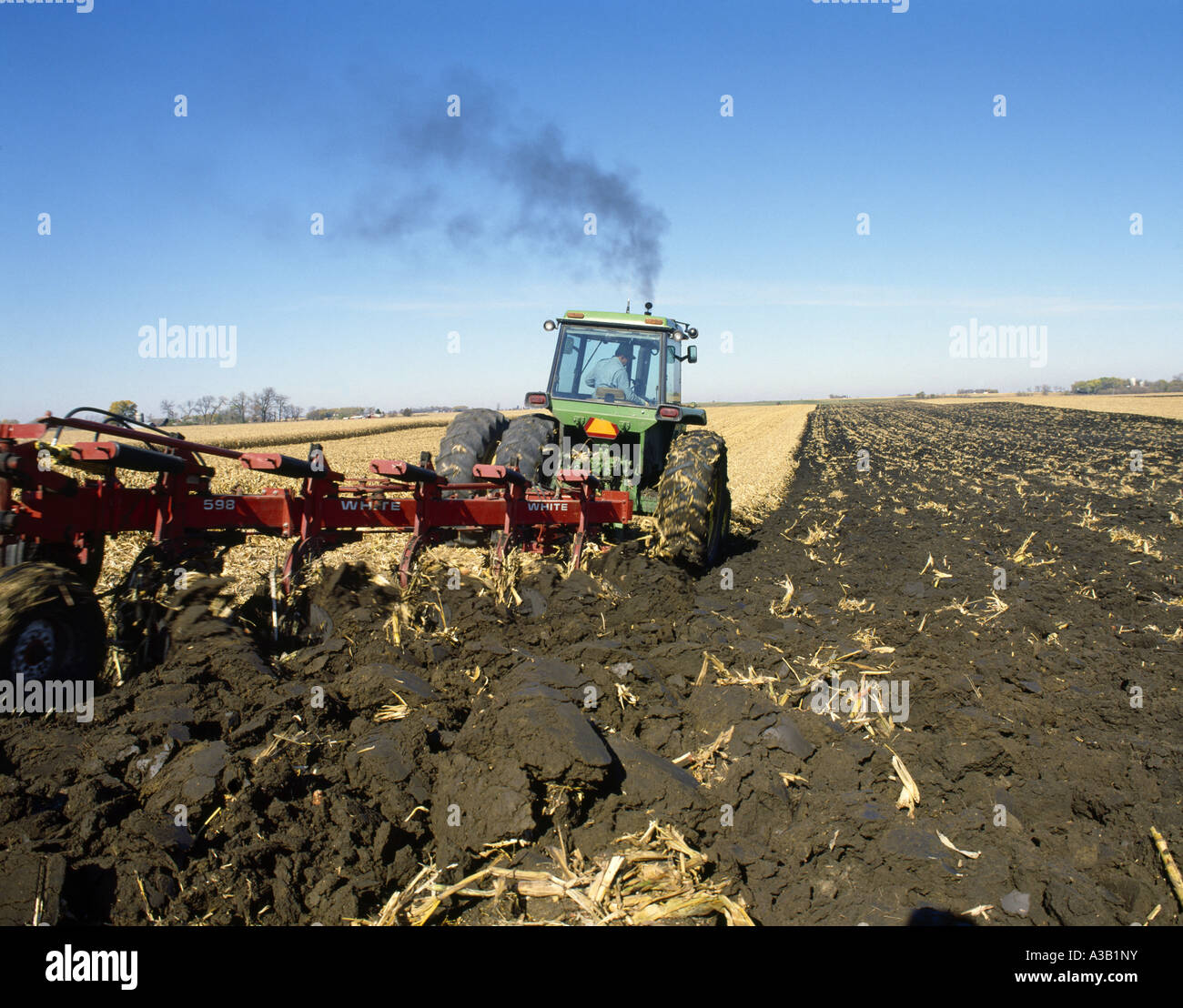 JOHN DEERE TRACTOR PLOWING UNDER CORN STUBBLE / MINNESOTA Stock Photo ...
