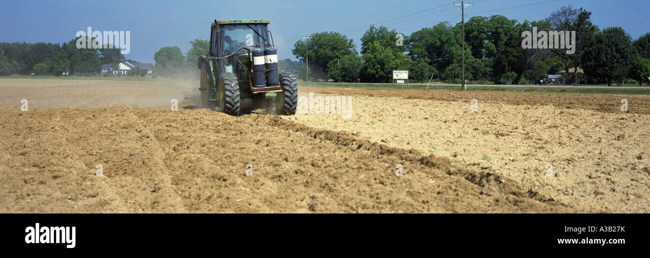 TRACTOR DISCING LAND TO PREPARE FOR PLANTING WATERMELONS / GEORGIA ...