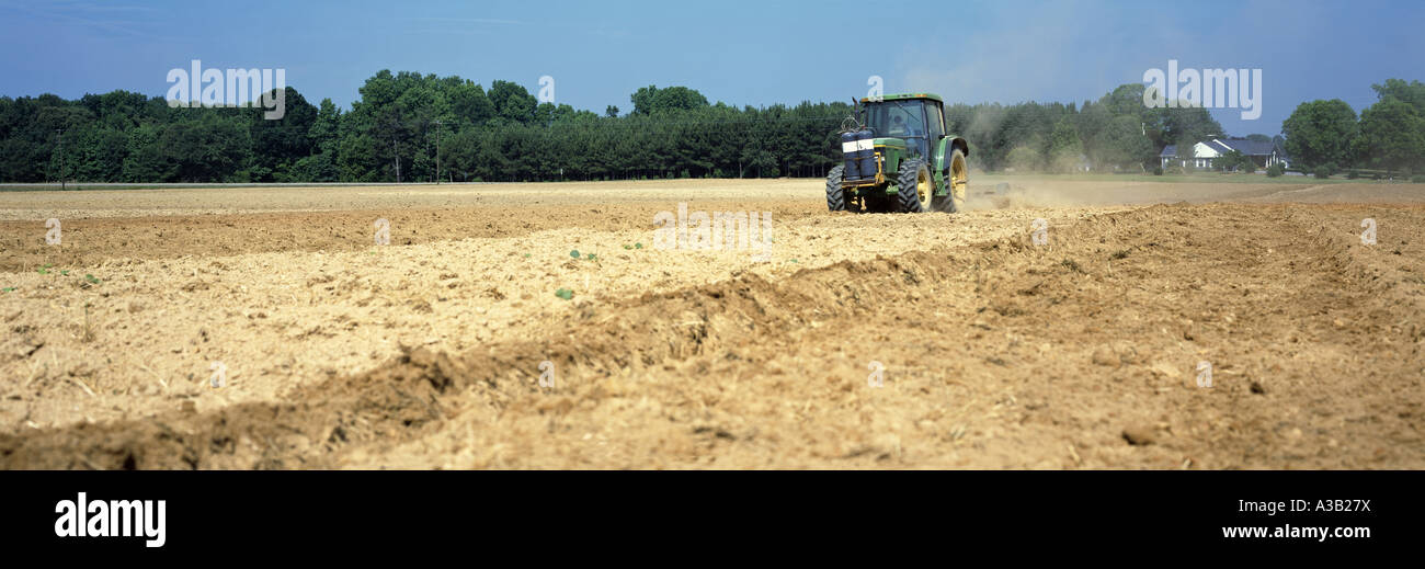 TRACTOR DISCING LAND TO PREPARE FOR PLANTING WATERMELONS / GEORGIA ...