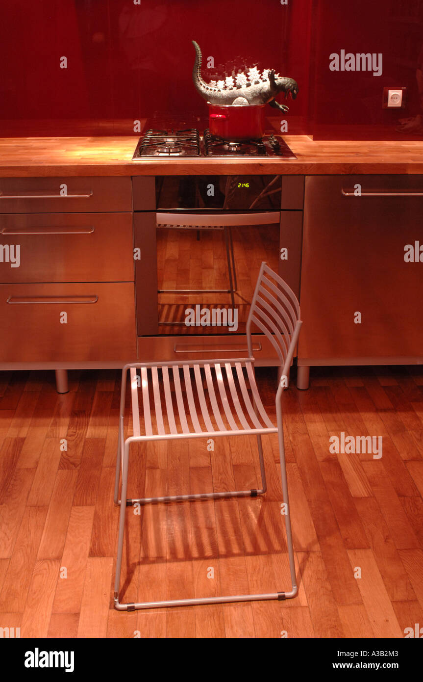 plastic Godzilla toy in red pot cooking on kitchen cooker Stock Photo ...