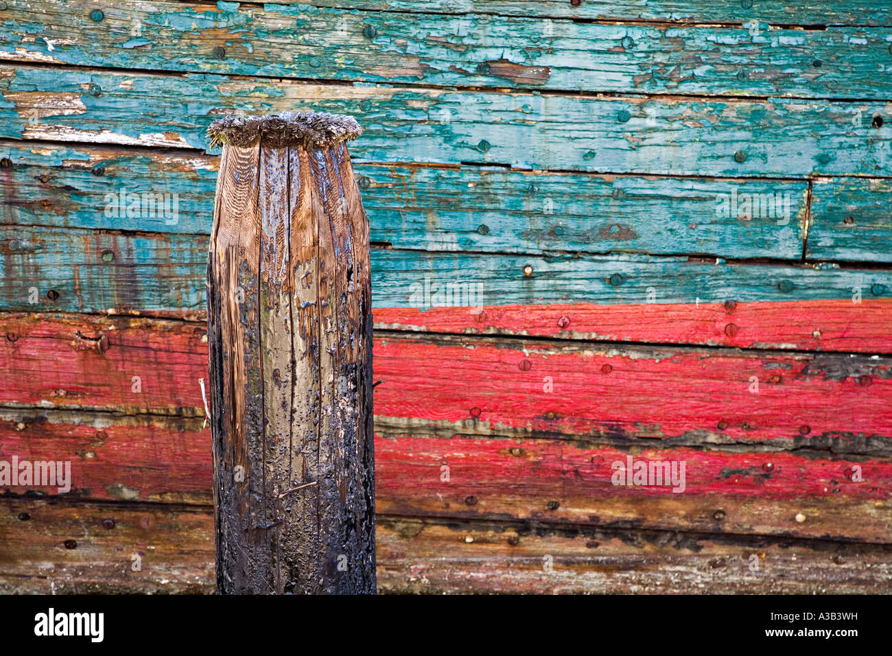 Worn piling with peeling paint on side of boat Seattle USA Stock Photo ...