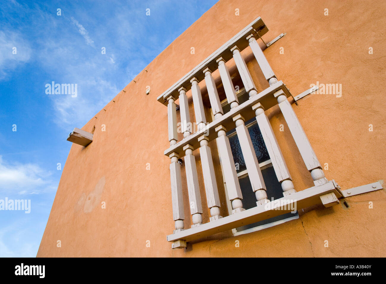 USA New Mexico Santa Fe Window with wooden bars for security on side of ...