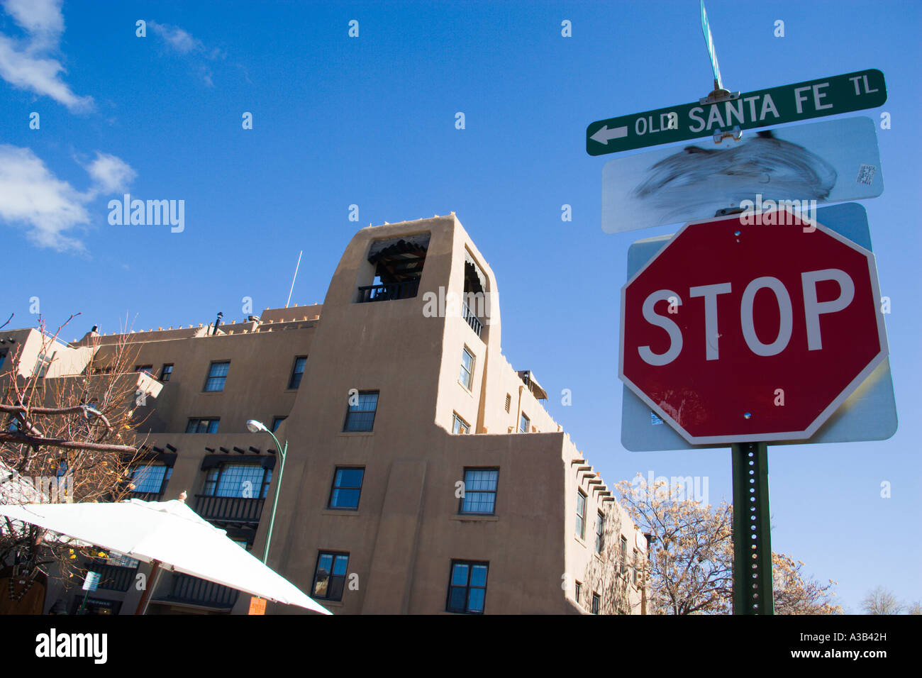 USA New Mexico Santa Fe Old Santa Fe Trail Stop sign and Adobe Pueblo ...