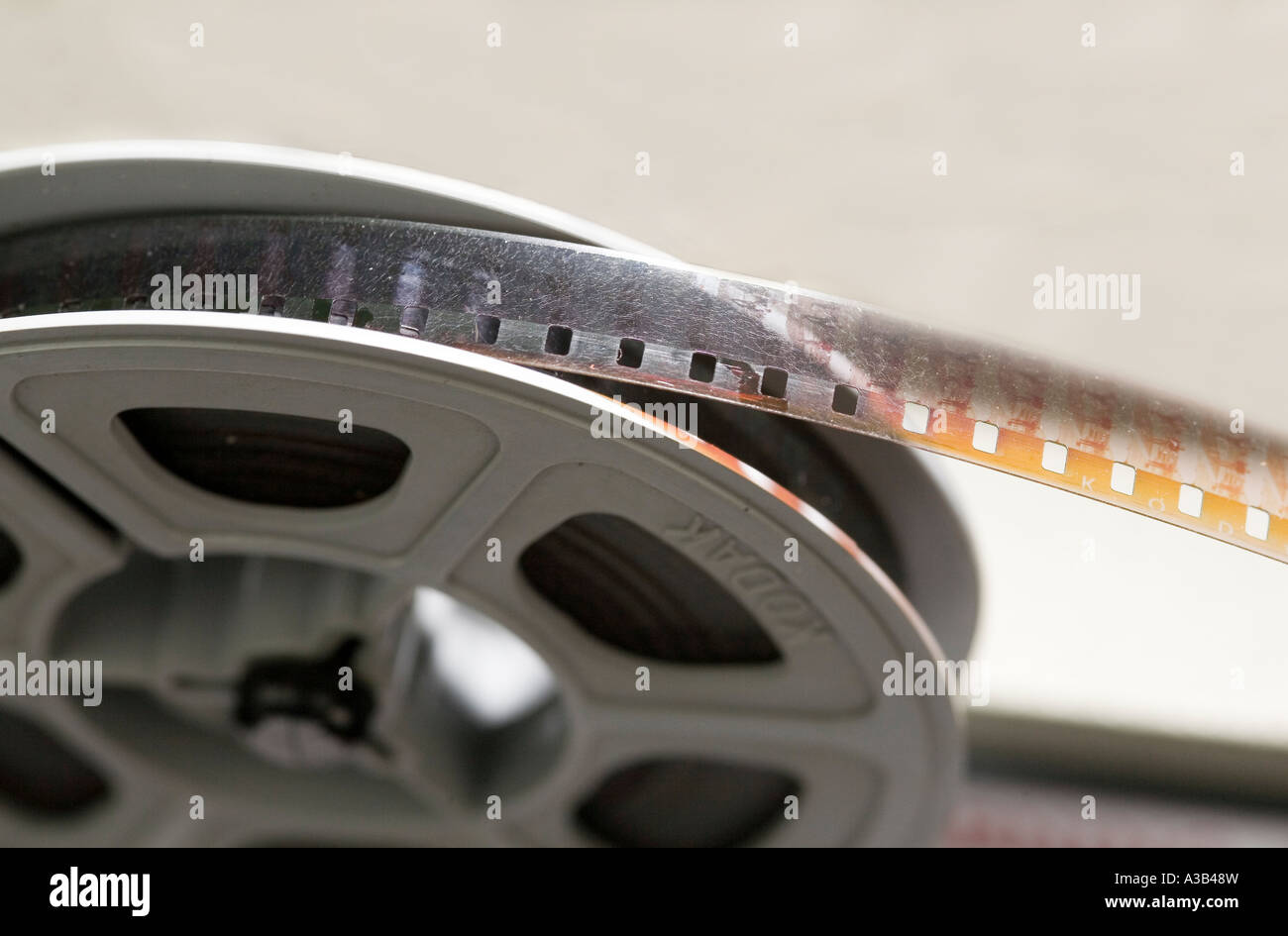 Amateur 8mm cine film on projector reel showing damage from age and ...