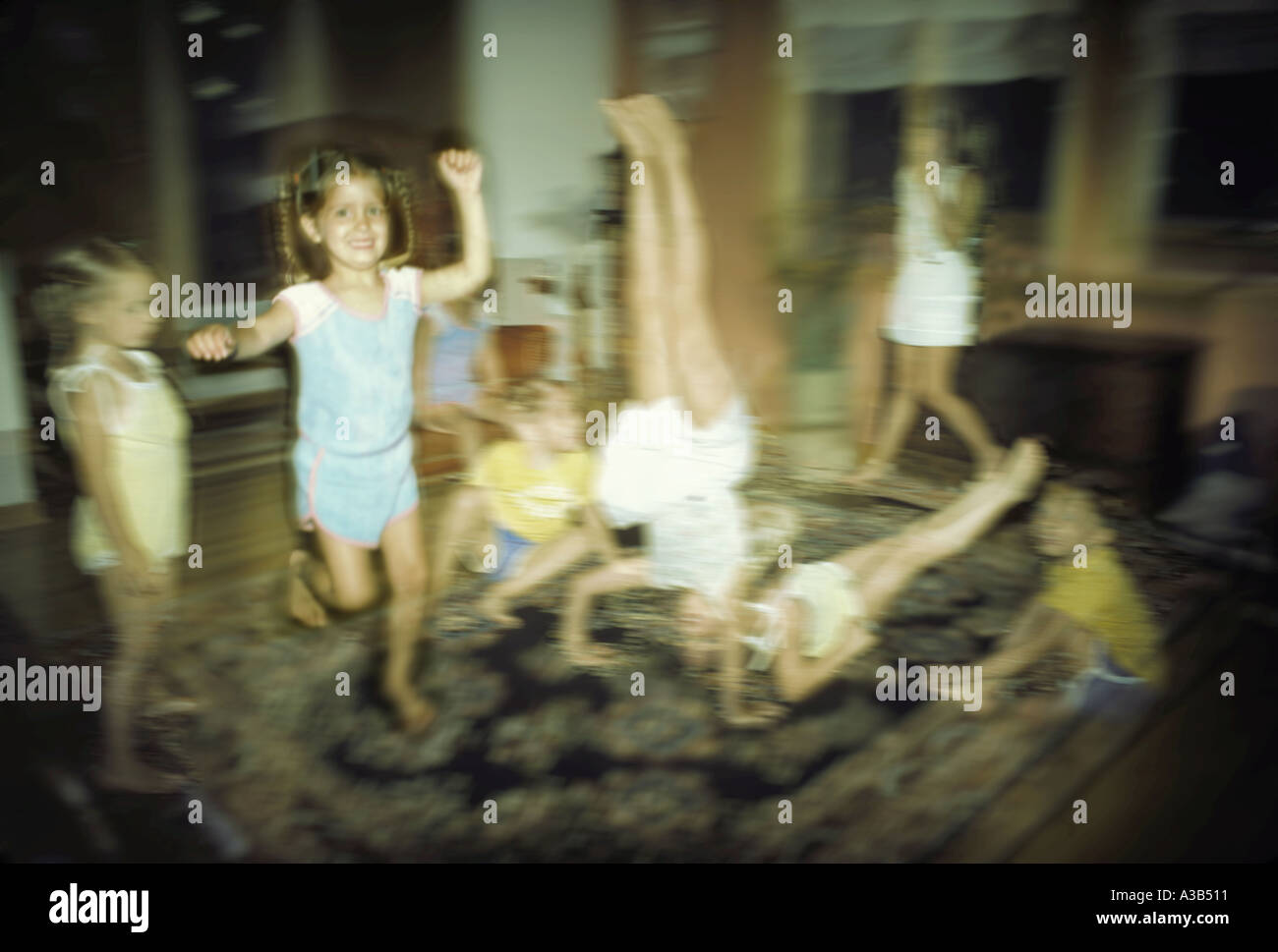 Children in motion: kids playing and excercising at family holiday ...