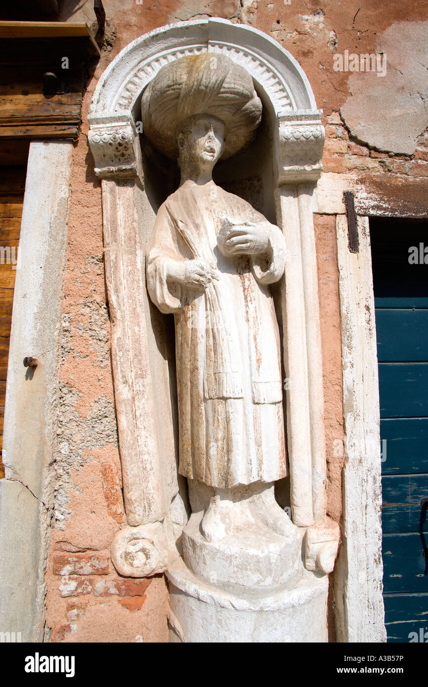 ITALY Veneto Venice Statue of Moorish man with turban by door to ...