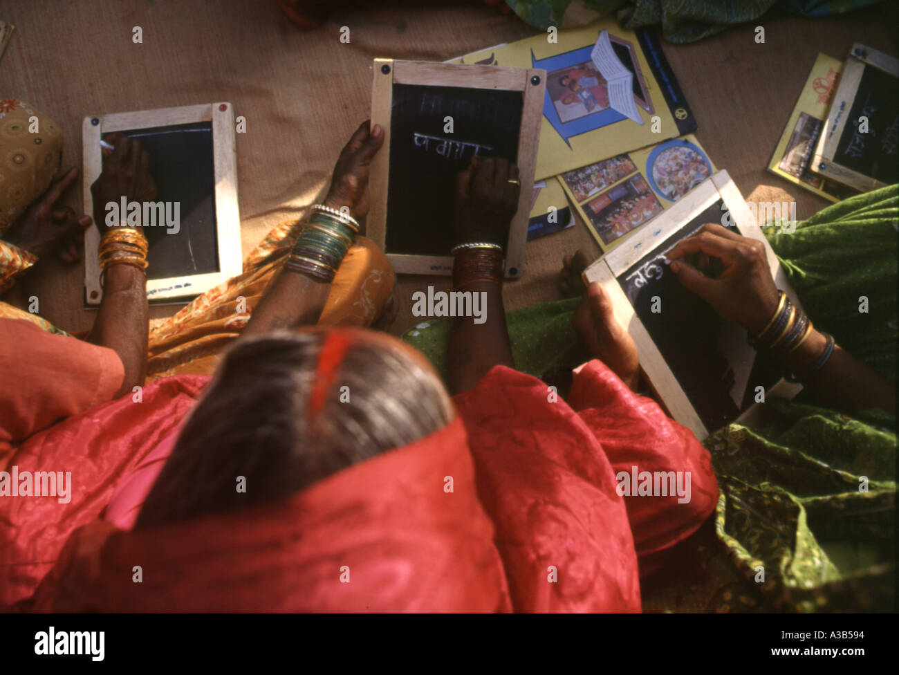 Women attending an adult education class in a village in Uttar Pradesh ...