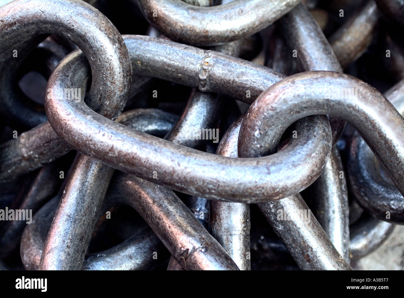 Heavy chain in a pile Stock Photo - Alamy