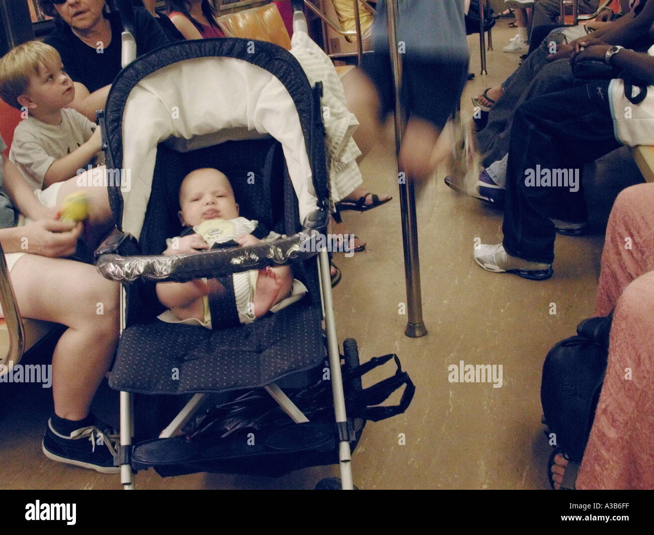 Baby and family on subway New York City USA Stock Photo - Alamy