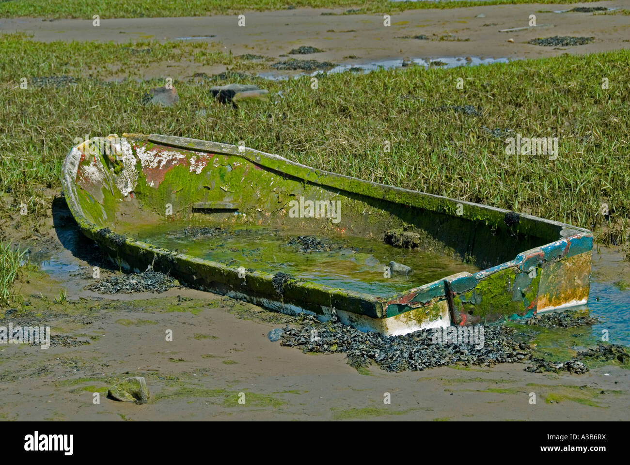 Derelict wooden boat on sandy beach. Rampside, Morcambe Bay, Cumbria ...