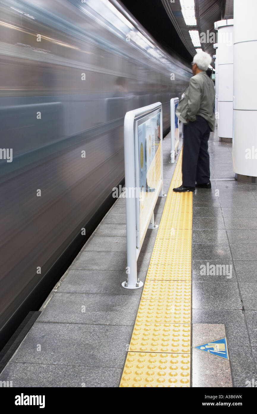 Man Standing On Subway Platform Stock Photo - Alamy