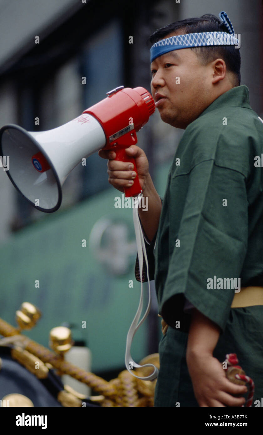 JAPAN Asia Honshu Tokyo Man with megaphone loudspeaker directing ...