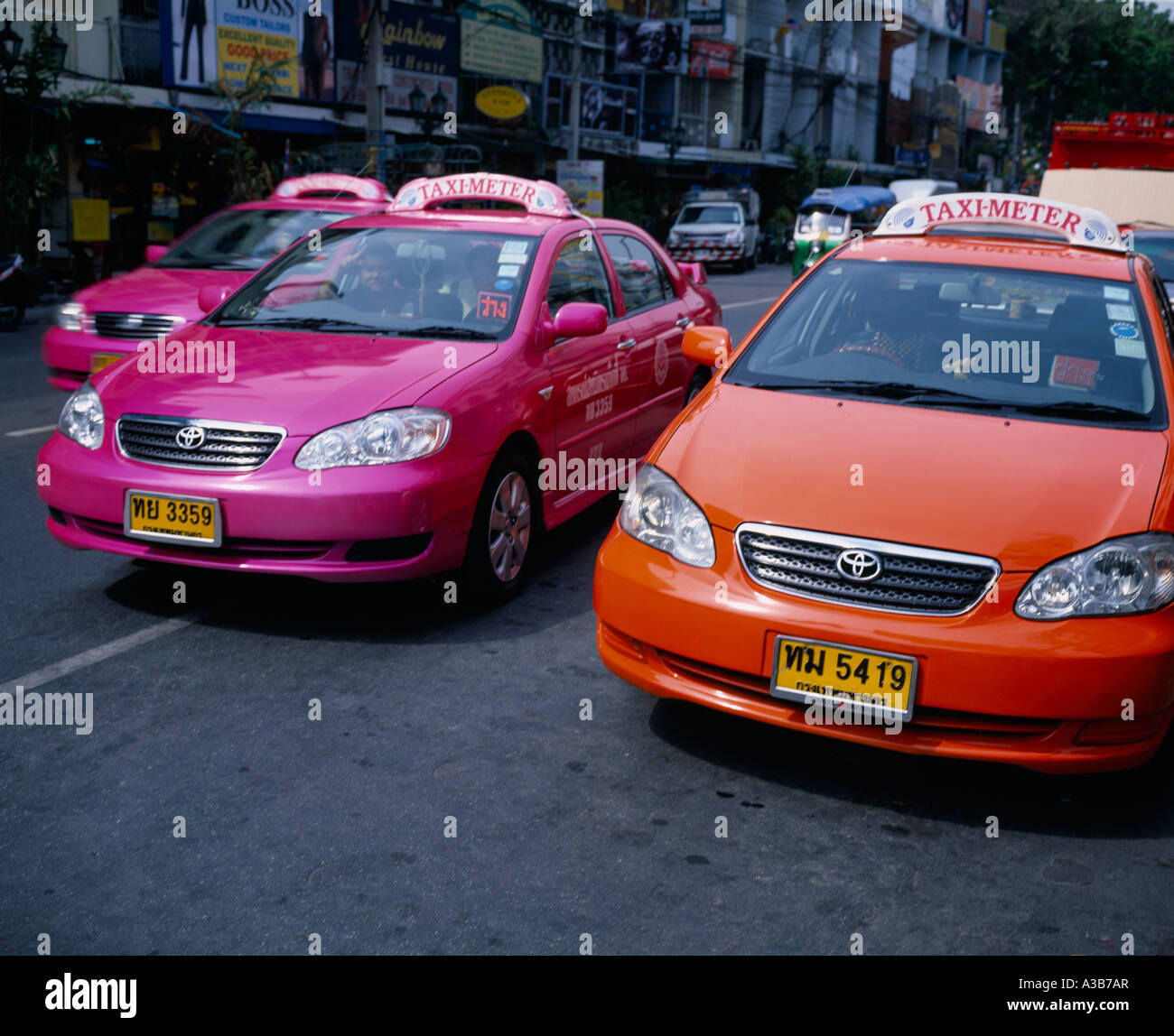 THAILAND Southeast Asia Bangkok Colourful pink and orange Toyota taxi ...