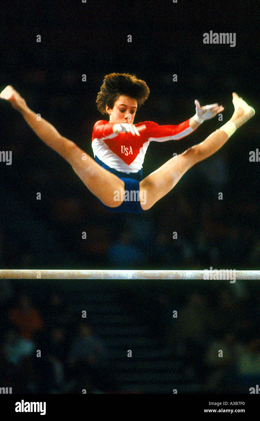 American gymnast competing on the asymmetric bars at Wembley Arena ...